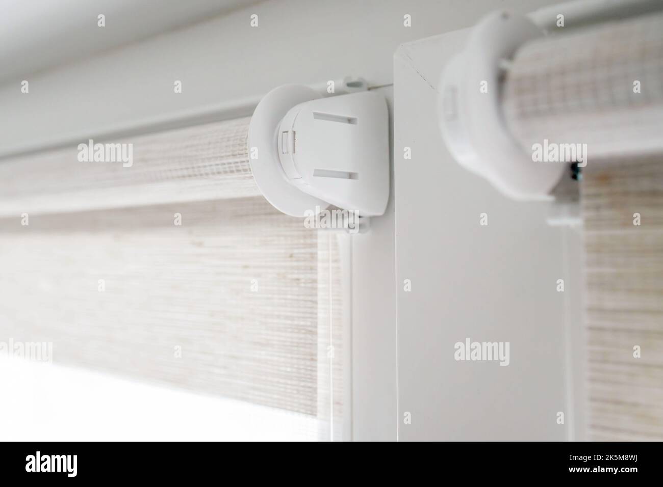 Close up mechanism of tnaninny roller blinds indoors. Duo window roller ...