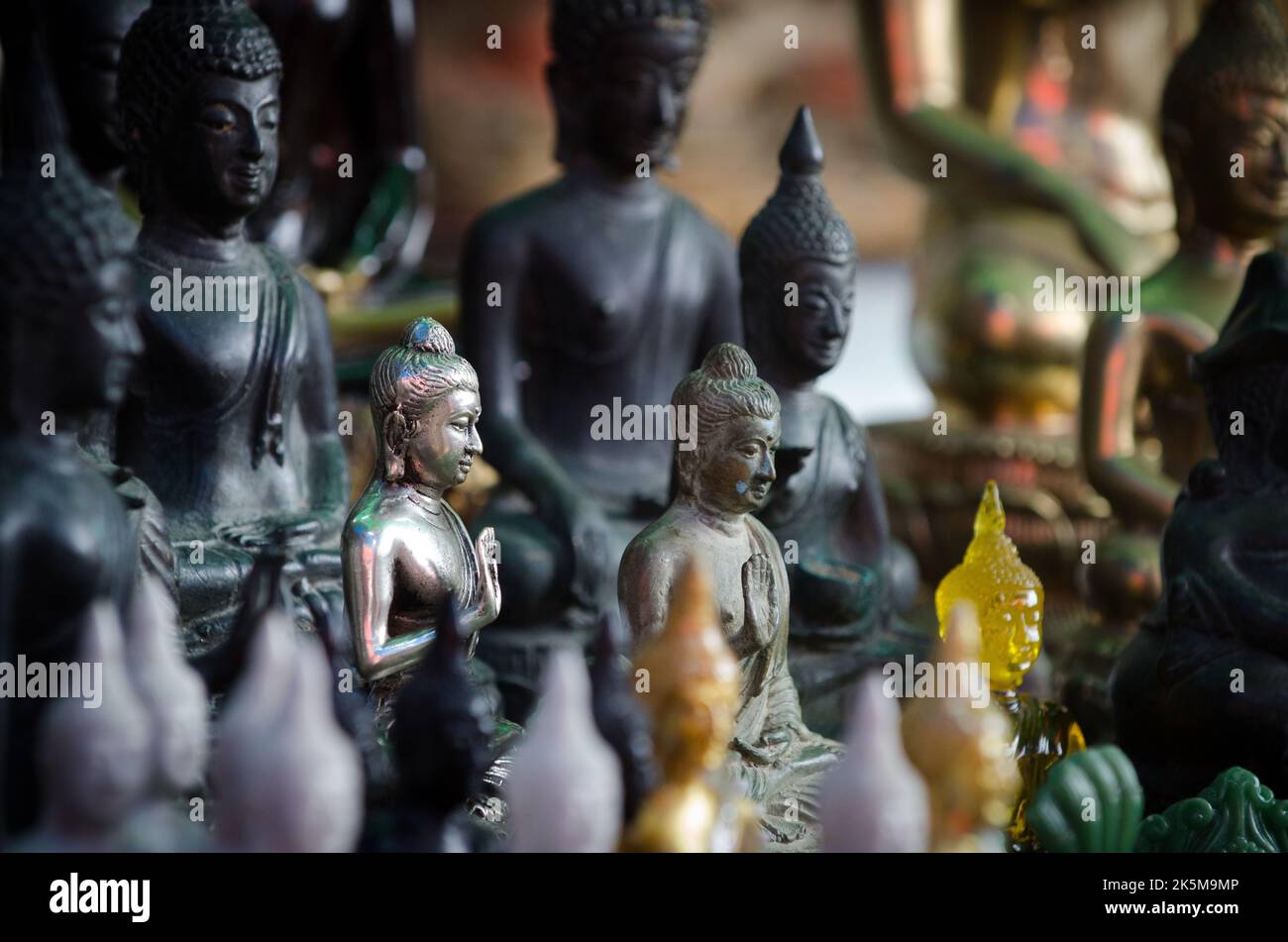 Small Buddha statue figures souvenirs Stock Photo - Alamy