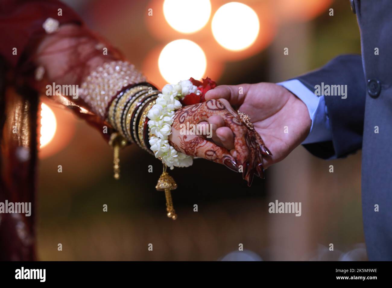 Pakistani Bride And Groom Holding Hands