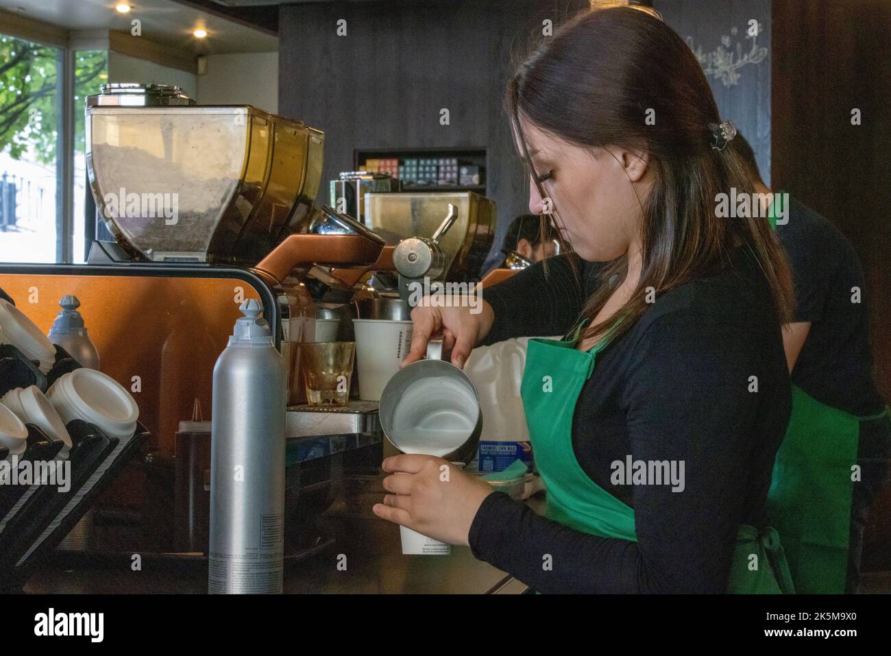 A Starbucks barista making coffee Stock Photo - Alamy