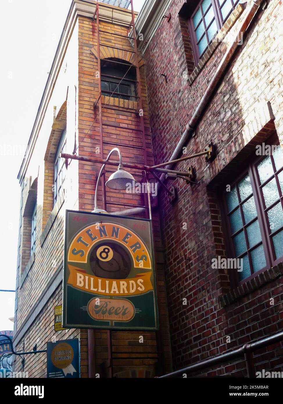 Sign for Stenner's Billiards and Beer hanging from a wall outside a ...