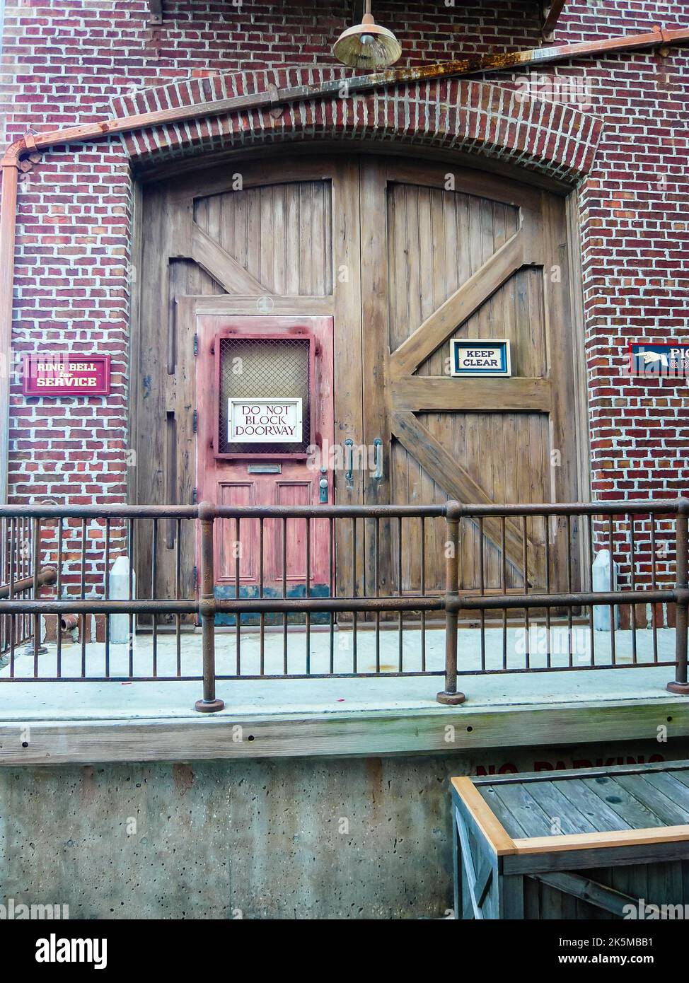 Signs on the double loading doors to the rear of an old fashioned ...