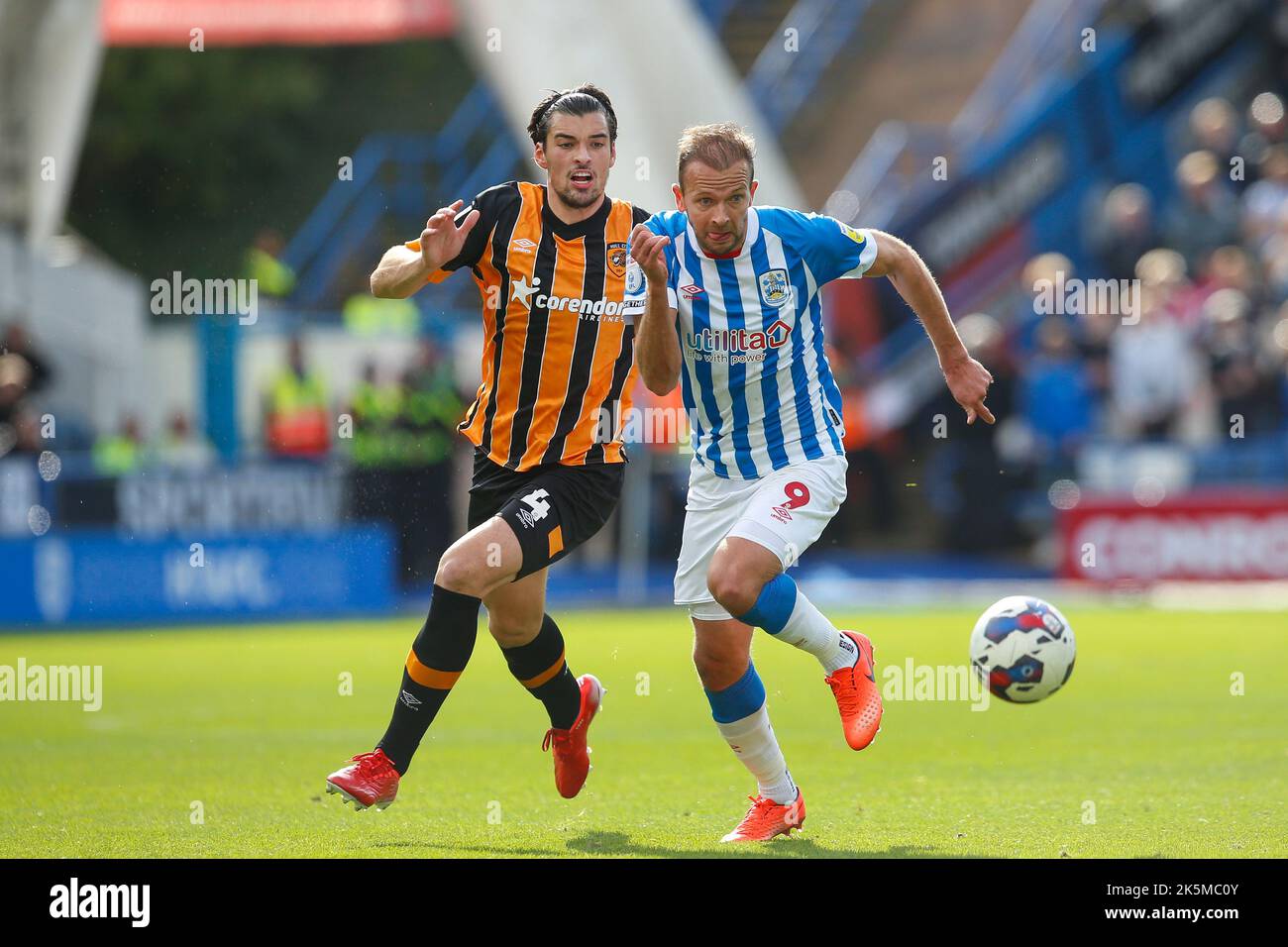 Jordan Rhodes #9 of Huddersfield Town and Jacob Greaves #4 of Hull City ...