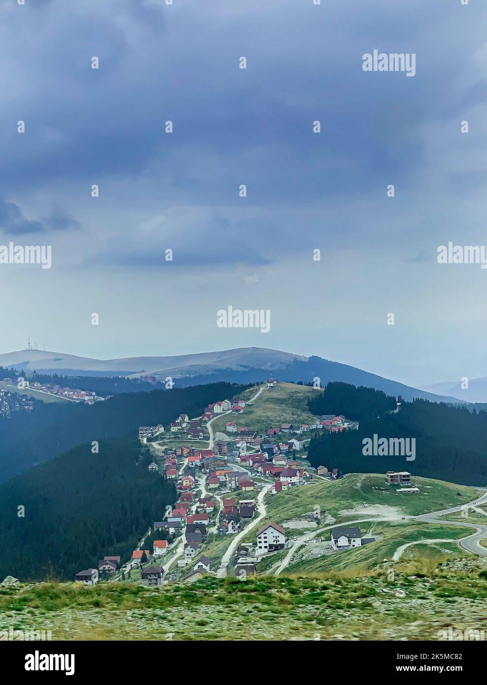 Dark clouds over village near Transalpina road, a beautiful alpine ...