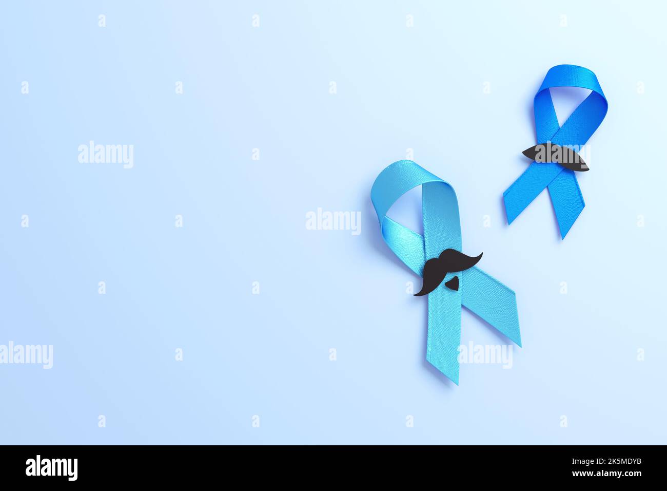 Two blue ribbons with moustache and copy space isolated on a blue ...