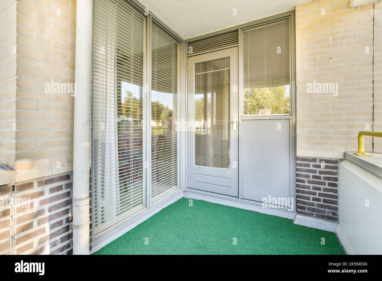 Front view of old brick buildings from small balcony Stock Photo - Alamy