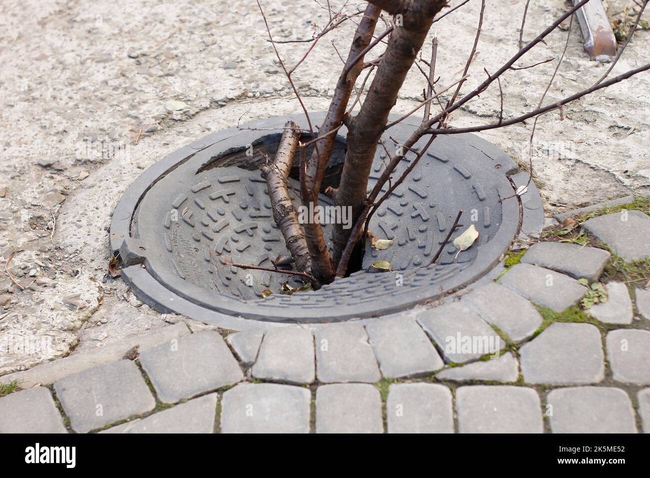 Broken manhole cover hi-res stock photography and images - Alamy