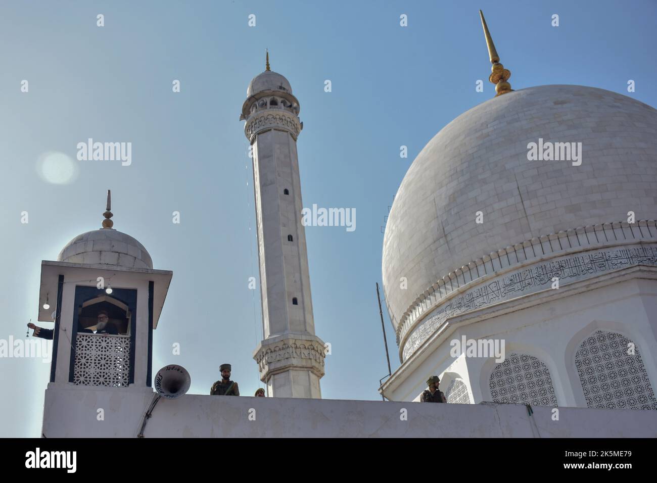Government forces stand alert as the head priest displays the holy ...