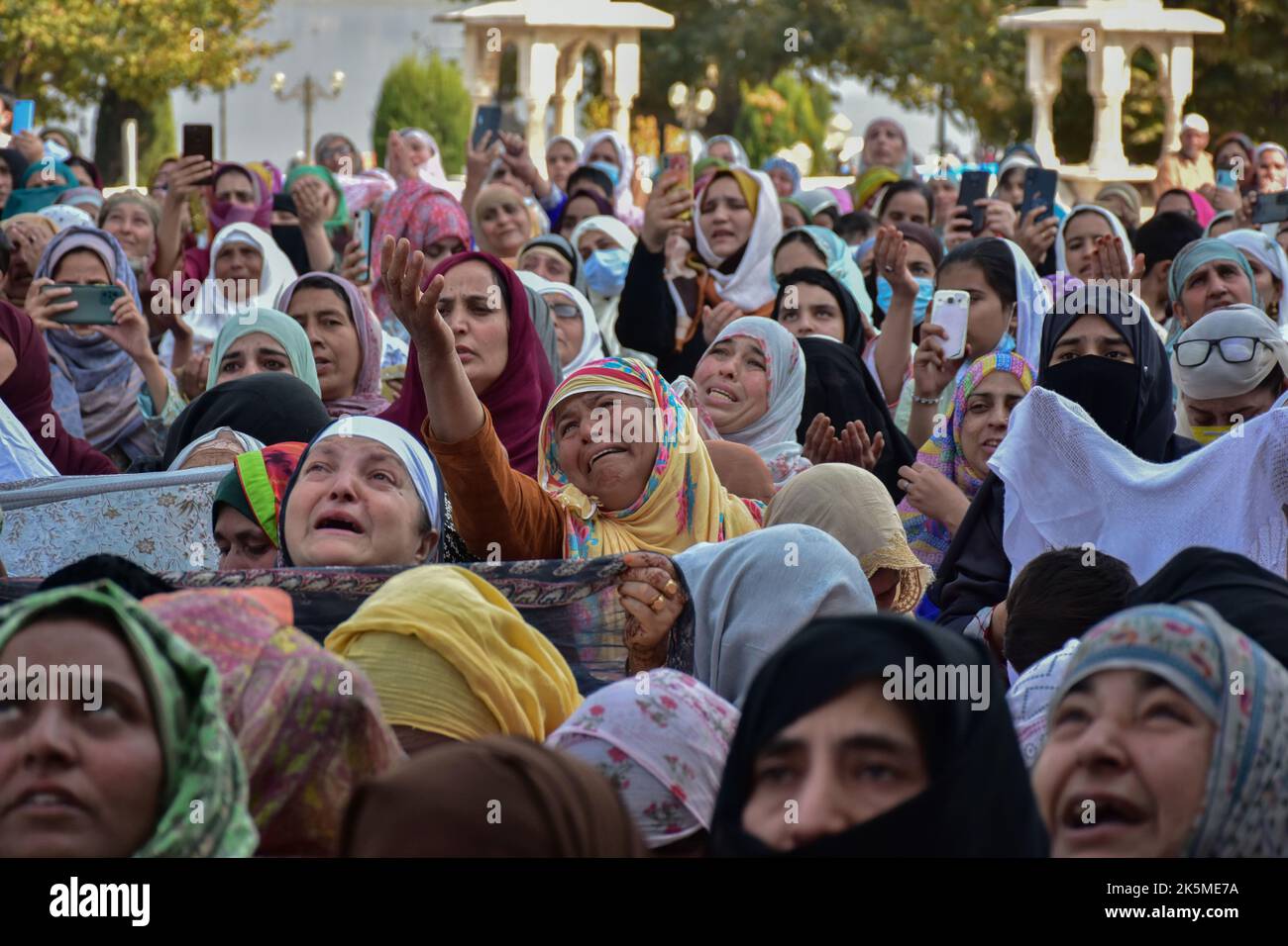 Kashmiri devotees pray as the head priest (not pictured) displays the ...