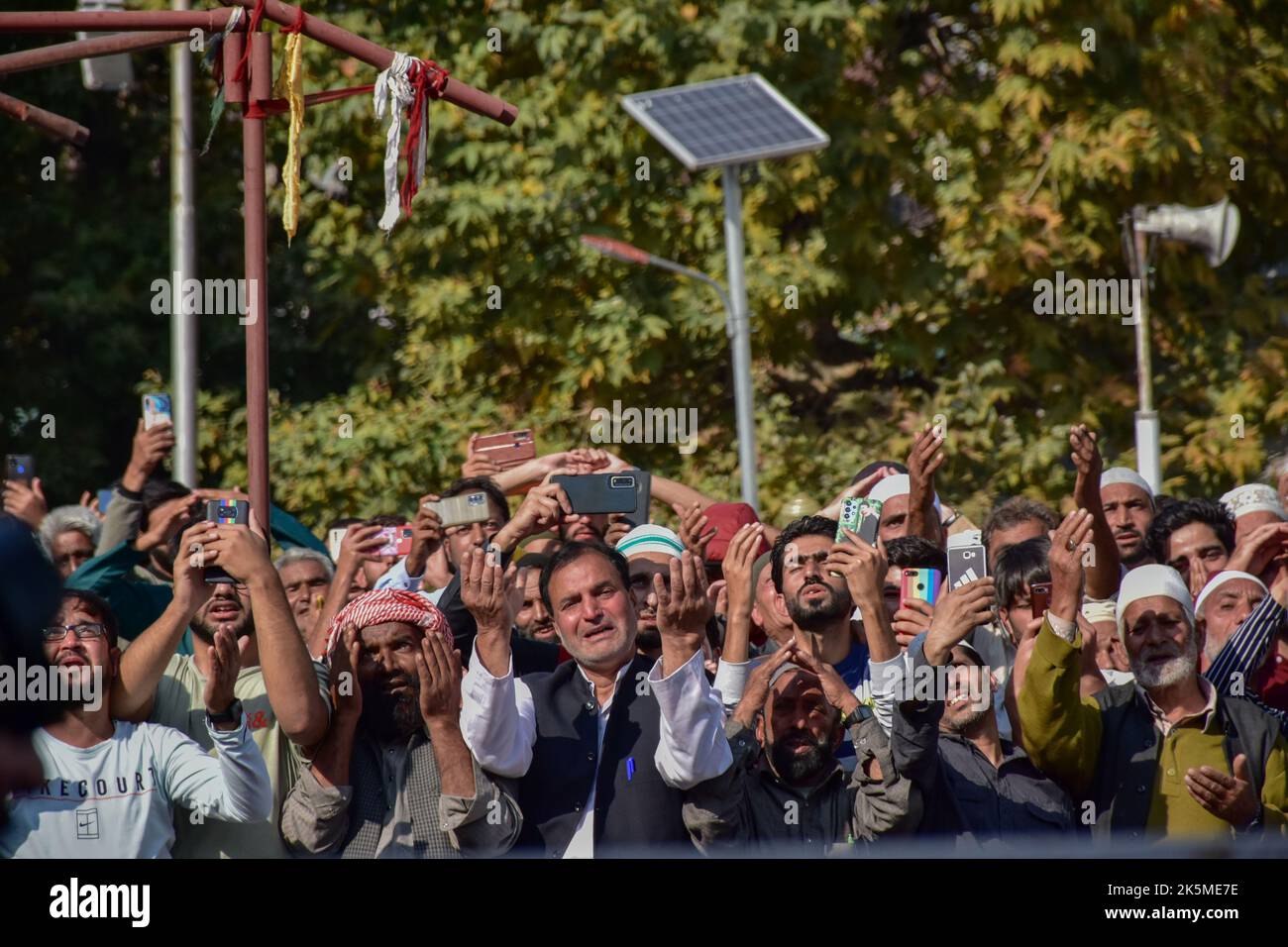 Kashmiri devotees pray as the head priest (not pictured) displays the ...