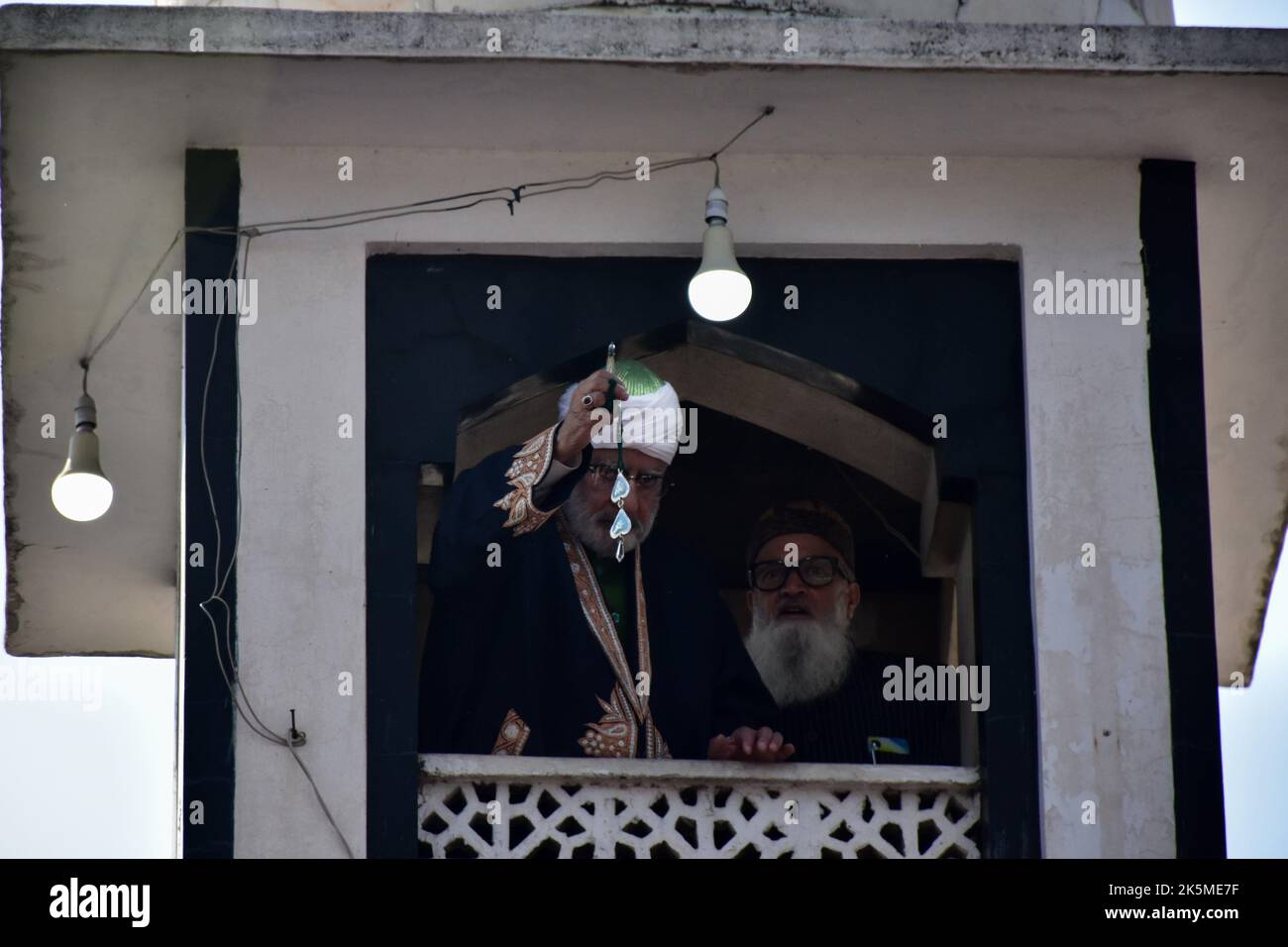 A head priest of the Hazratbal Shrine displays the holy relic believed ...