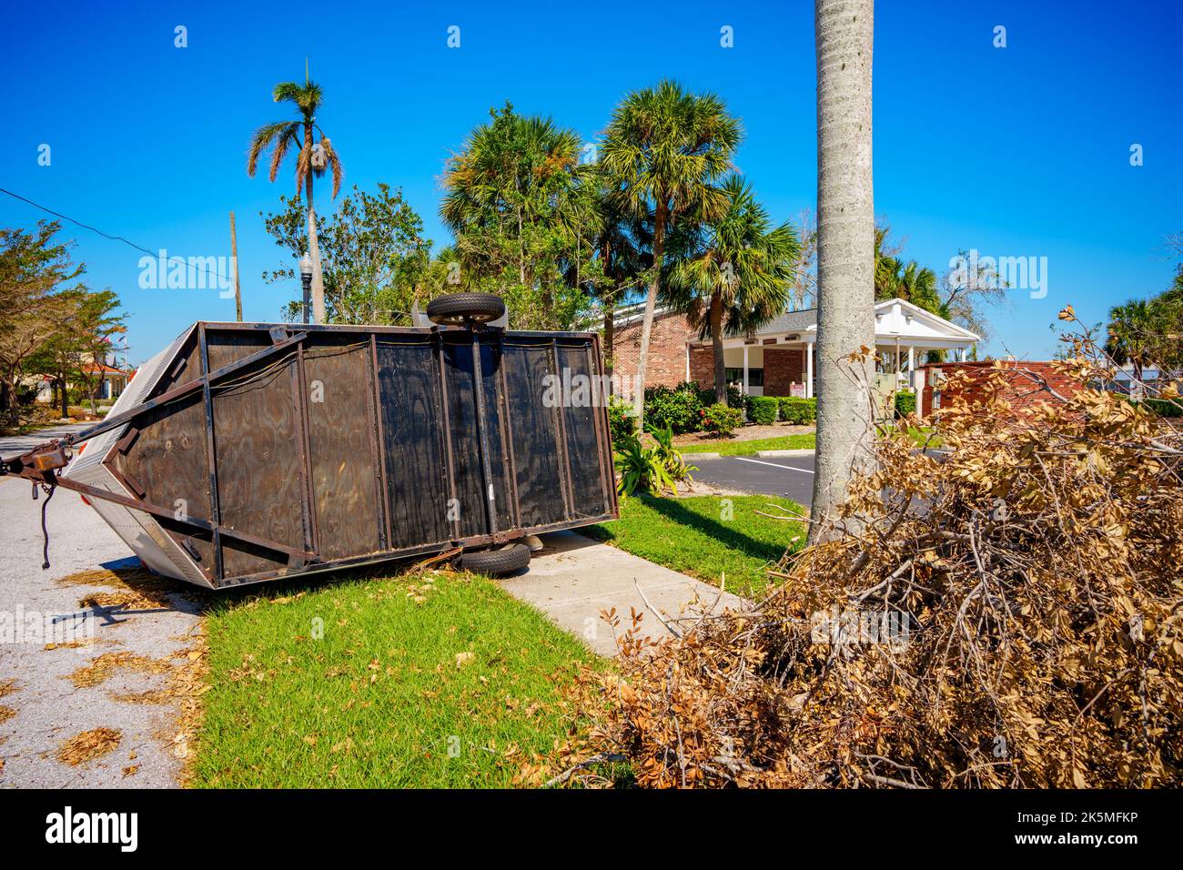 Trailer flipped on its side from heavy winds Hurricane Ian Stock Photo ...