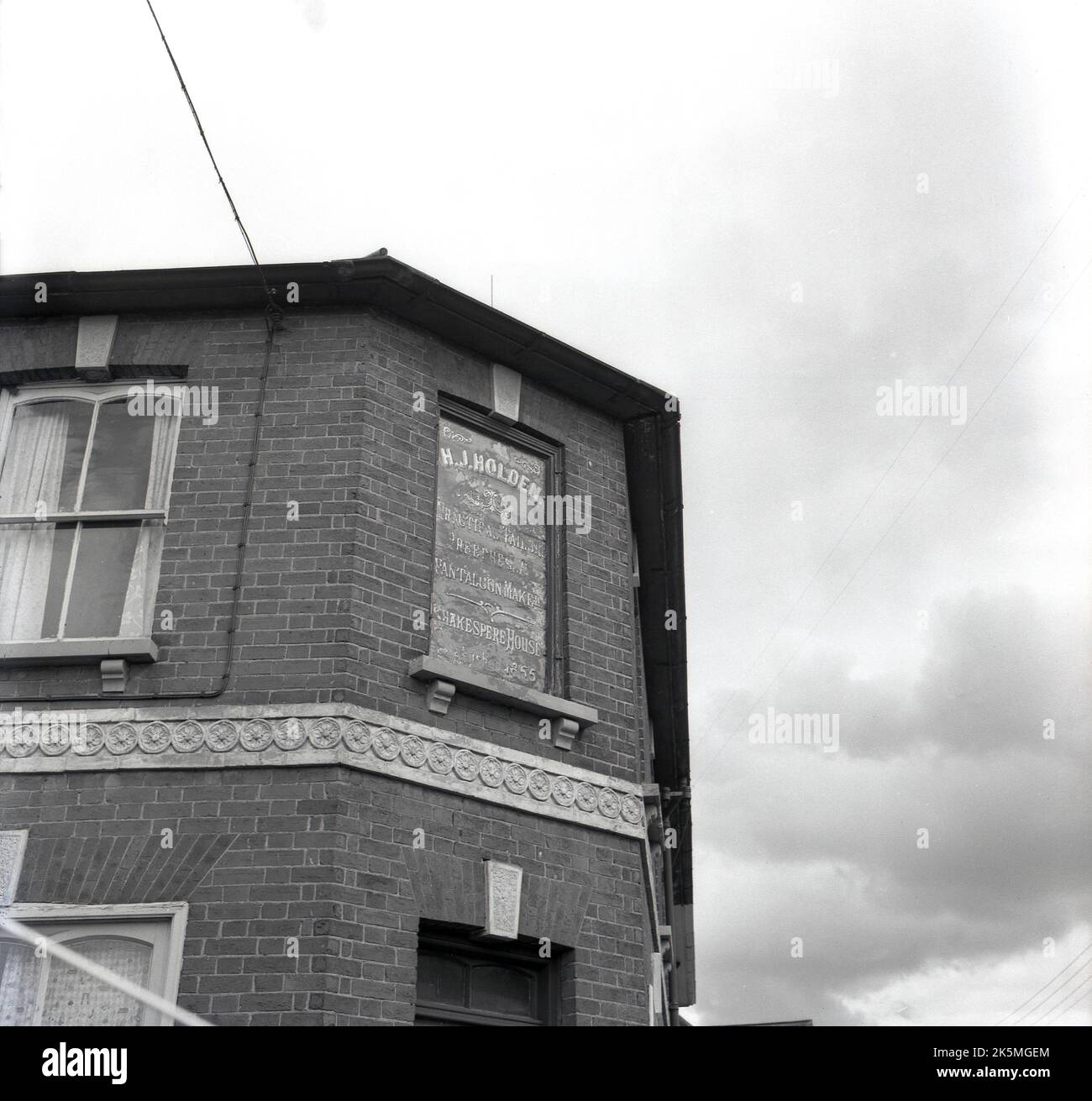 1964, historical, decayingsign on wall of brick building for J. J ...