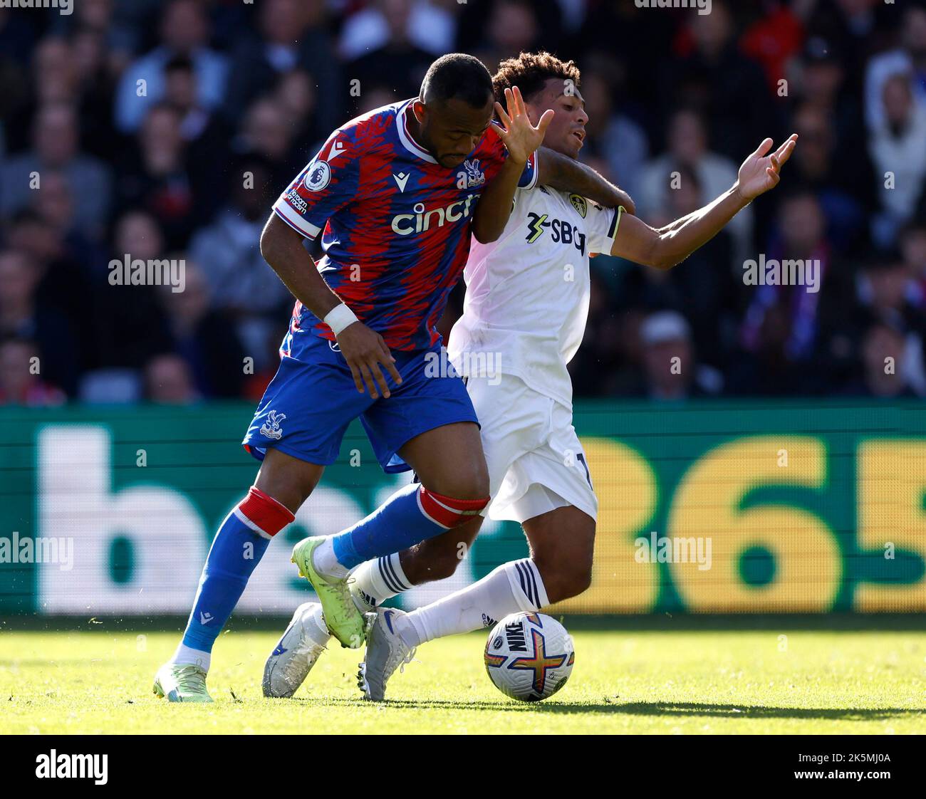 Crystal Palace's Jordan Ayew (left) and Leeds United's Tyler Adams ...