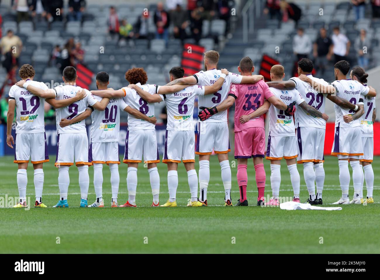 SYDNEY, AUSTRALIA - OCTOBER 9: The Perth Glory team stand for a moment ...