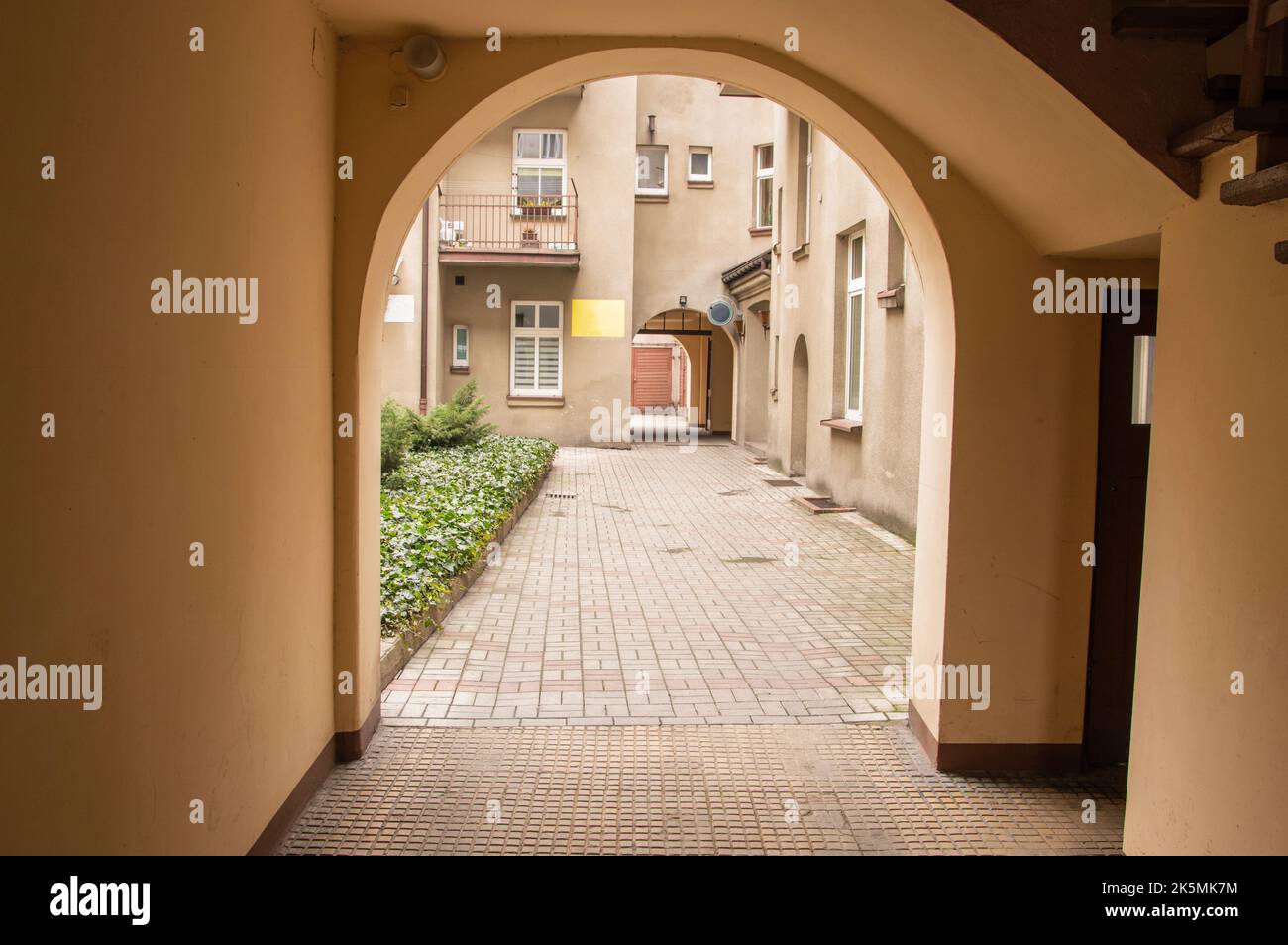 Alley between houses and yards in the old town on a cloudy day Stock ...