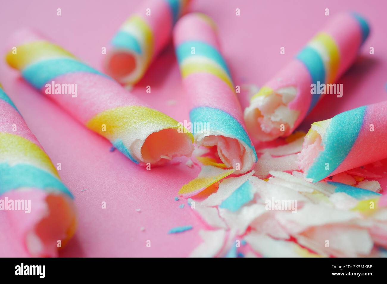 colorful wafer roll chocolate on pink background Stock Photo - Alamy