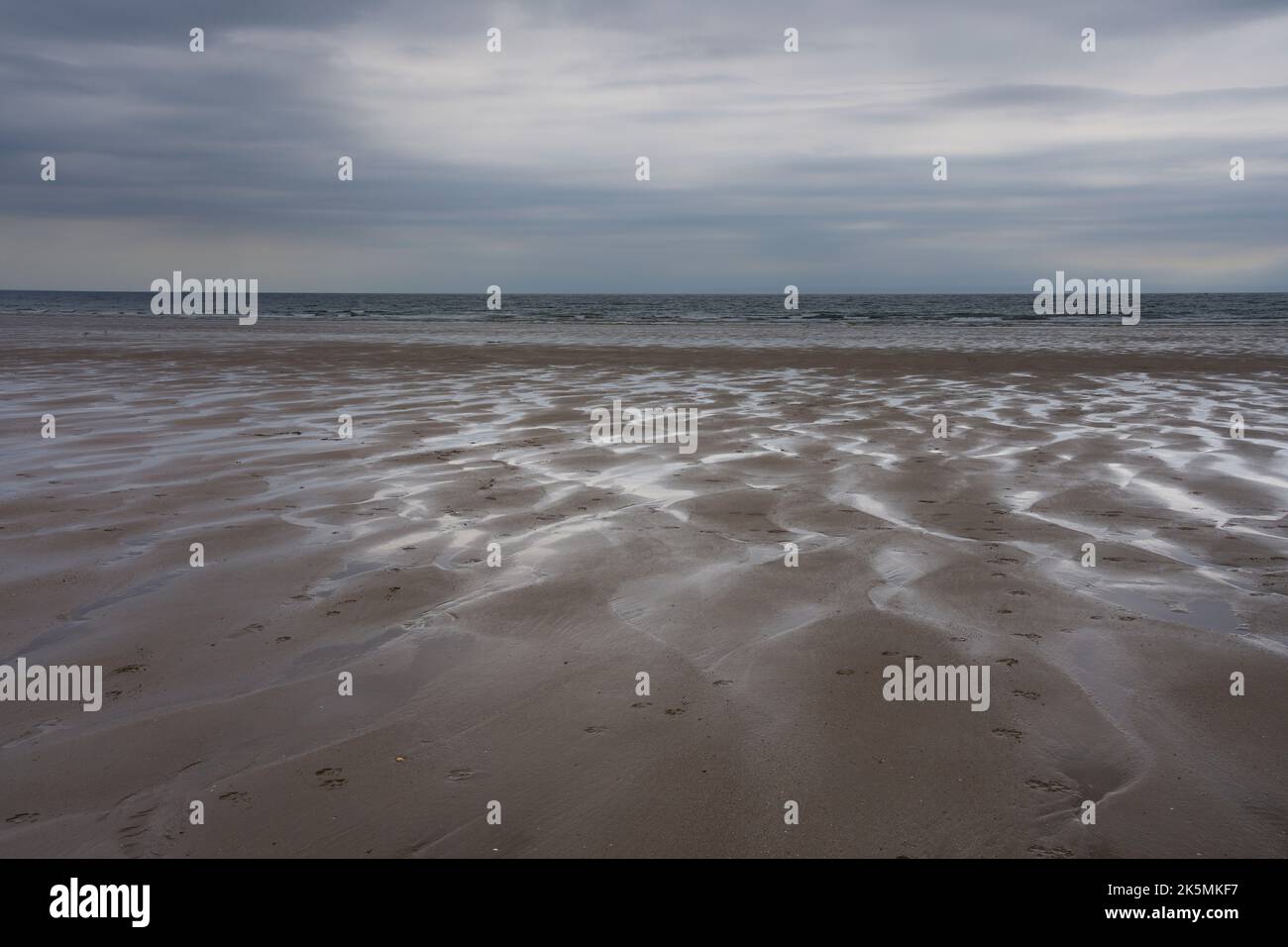 Cold and dismal September afternoon on the beach at Oxwich Bay Stock ...