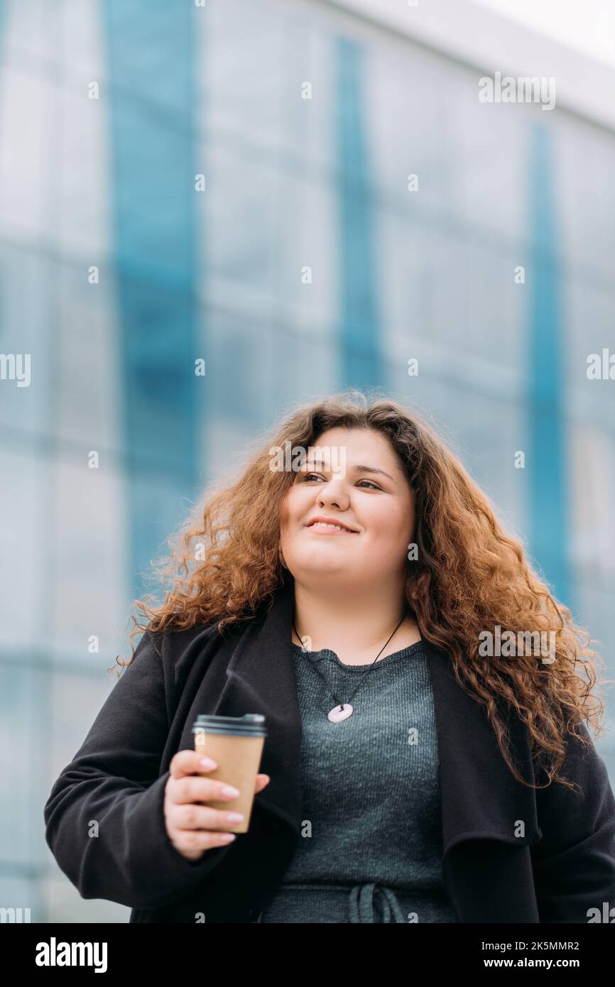 coffee lover pleased curvy woman enjoying moment Stock Photo - Alamy