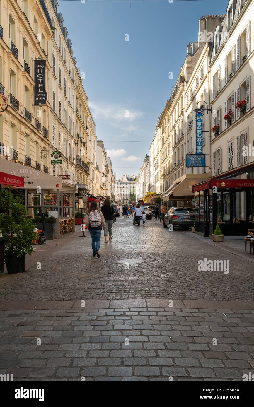 A vertical shot of the famous Rue Cler street in Paris Stock Photo - Alamy