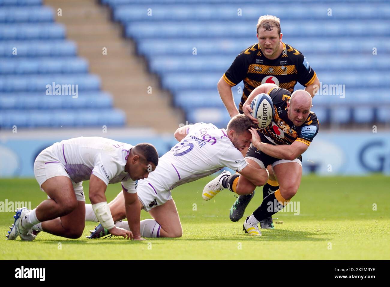 Wasps Dan Robson is tackled by Northampton Saints Dan Biggar during the ...