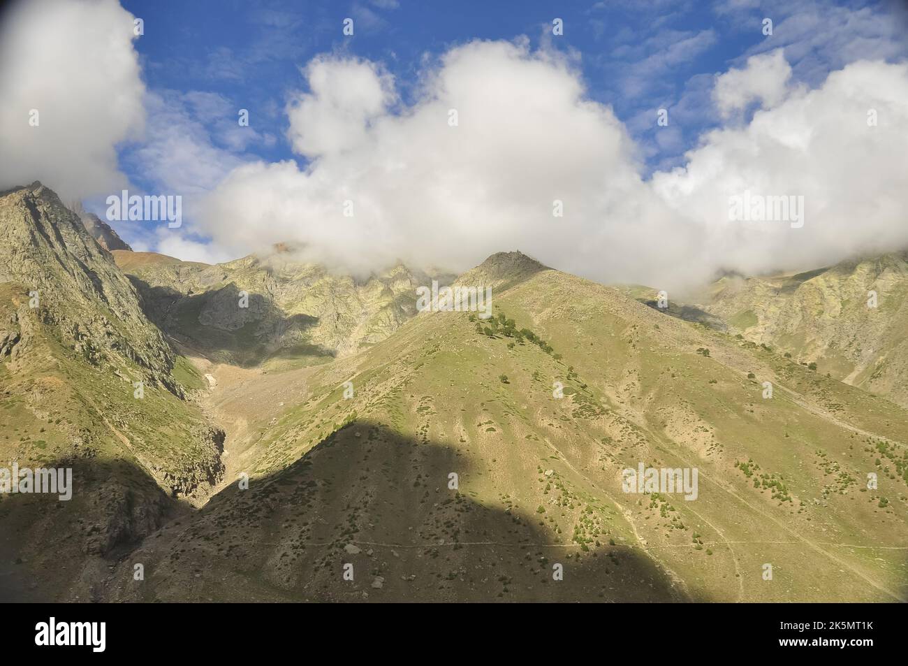 Morning landscape view of dry mountains covered from the peak with ...
