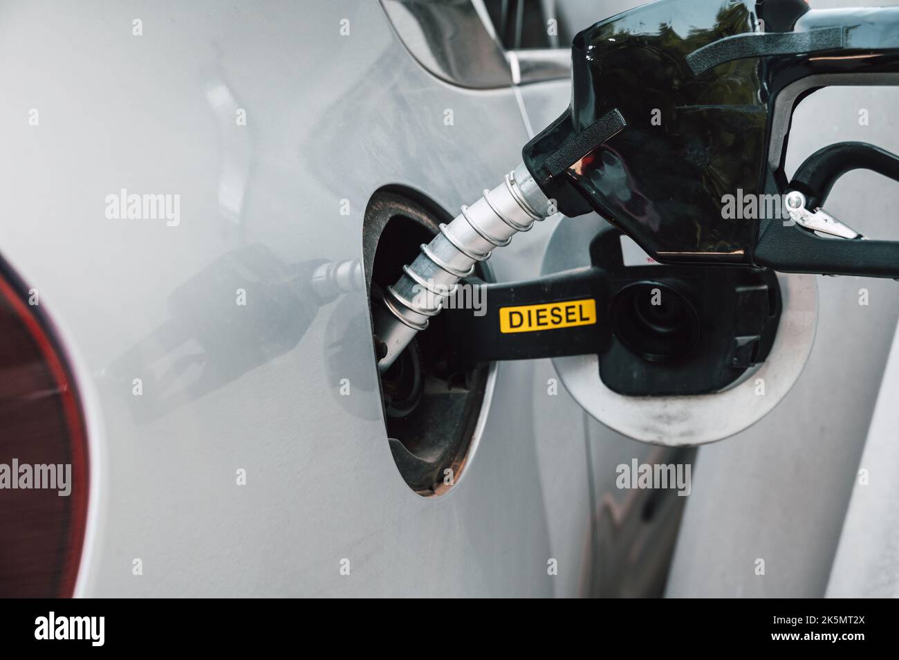 Fuel pump fill a tank of a car in a station Stock Photo - Alamy