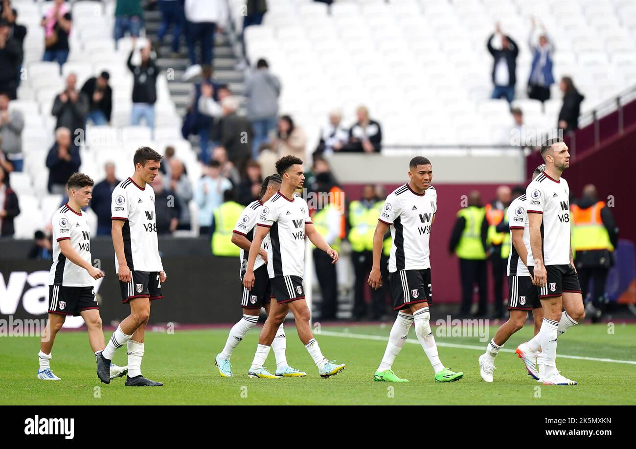 Fulham players look dejected following defeat after the final whistle ...