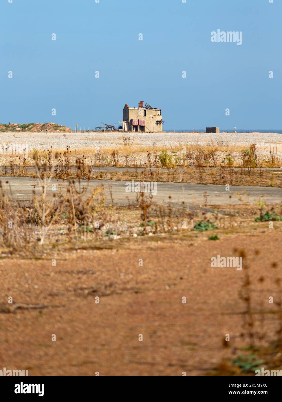 Shingle landscape with abandoned coastguard lookout building in the ...