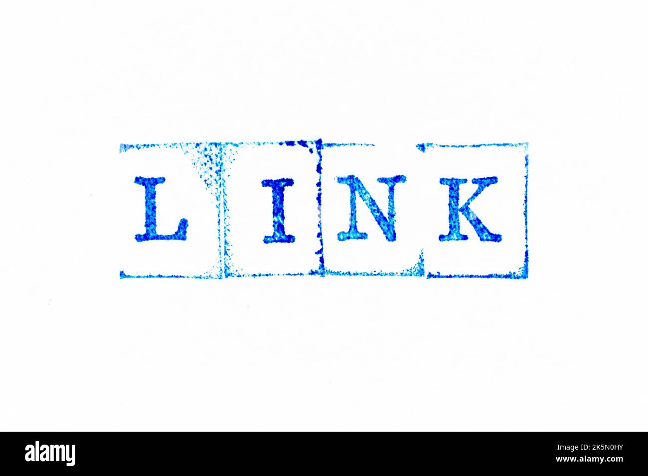Blue color ink rubber stamp in word link on white paper background ...