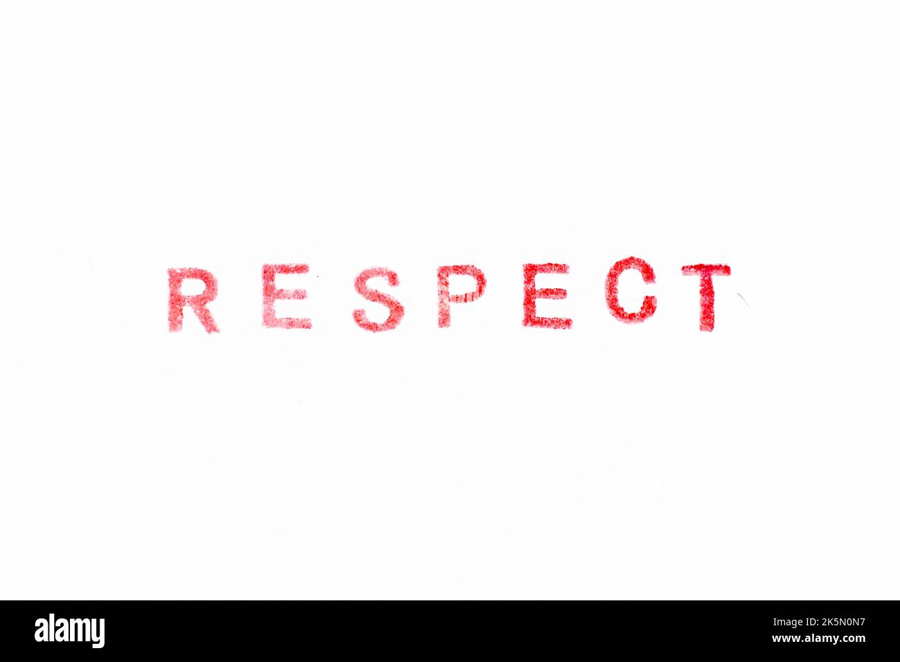 Red color ink rubber stamp in word respect on white paper background ...