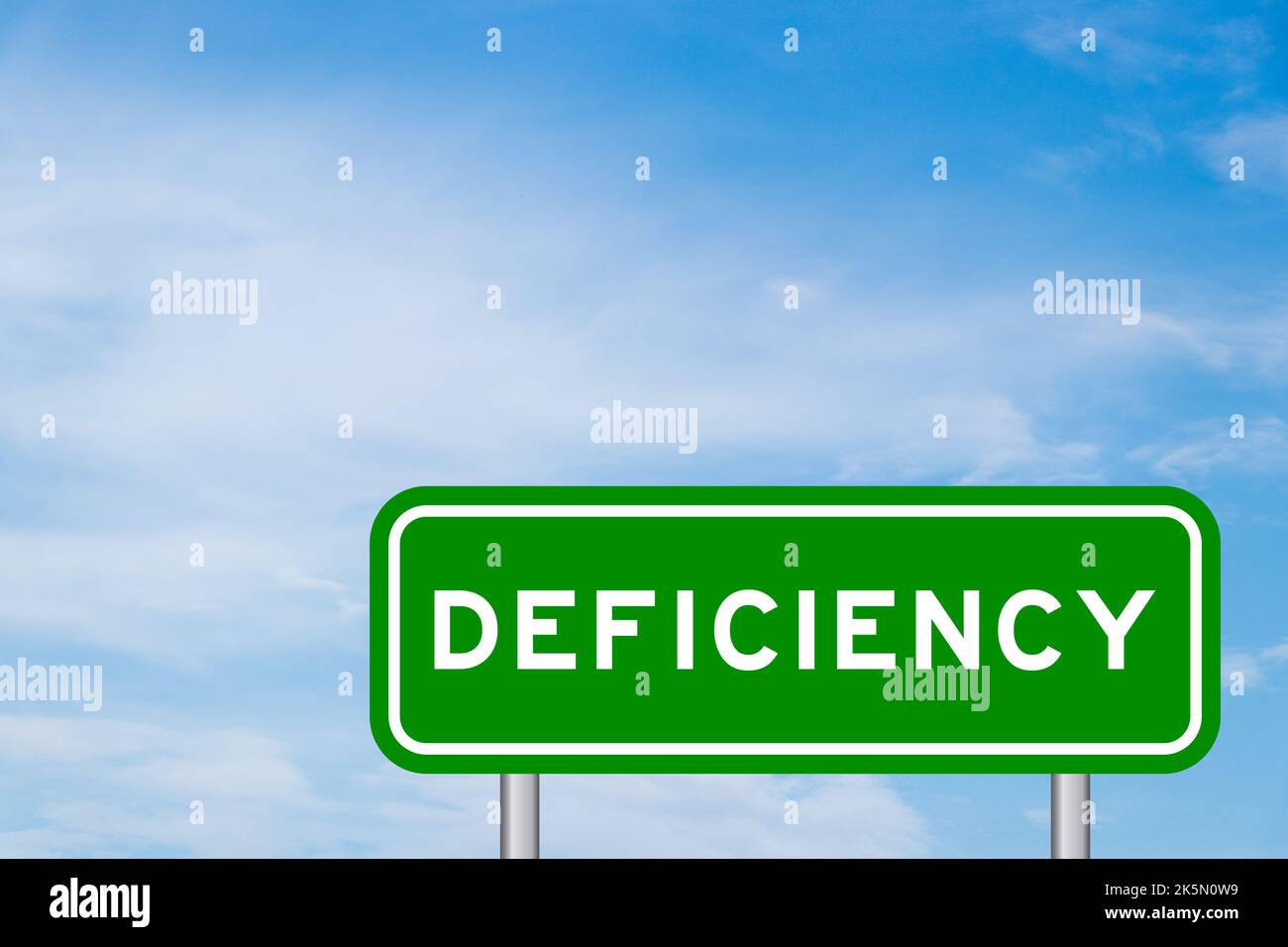 Green color transportation sign with word deficiency on blue sky with ...