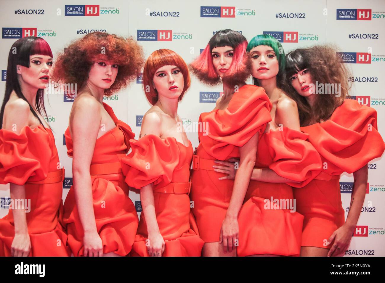 Girls in orange dresses and high heels hi-res stock photography and ...