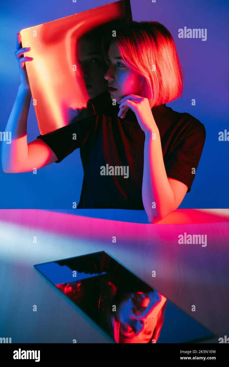 Pensive woman. Neon art portrait. Mental contemplation. Confused ...