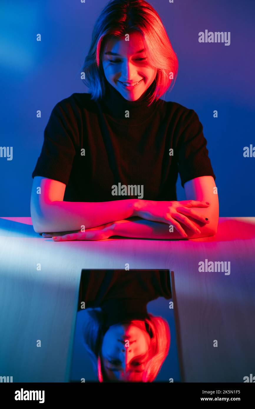 Bipolar disorder. Neon portrait. Mood change. Happy smiling girl with ...