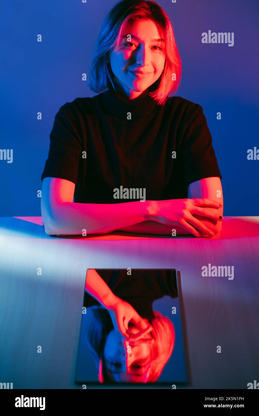 Female secret. Neon light portrait. Keep quiet. Happy relaxed smiling ...