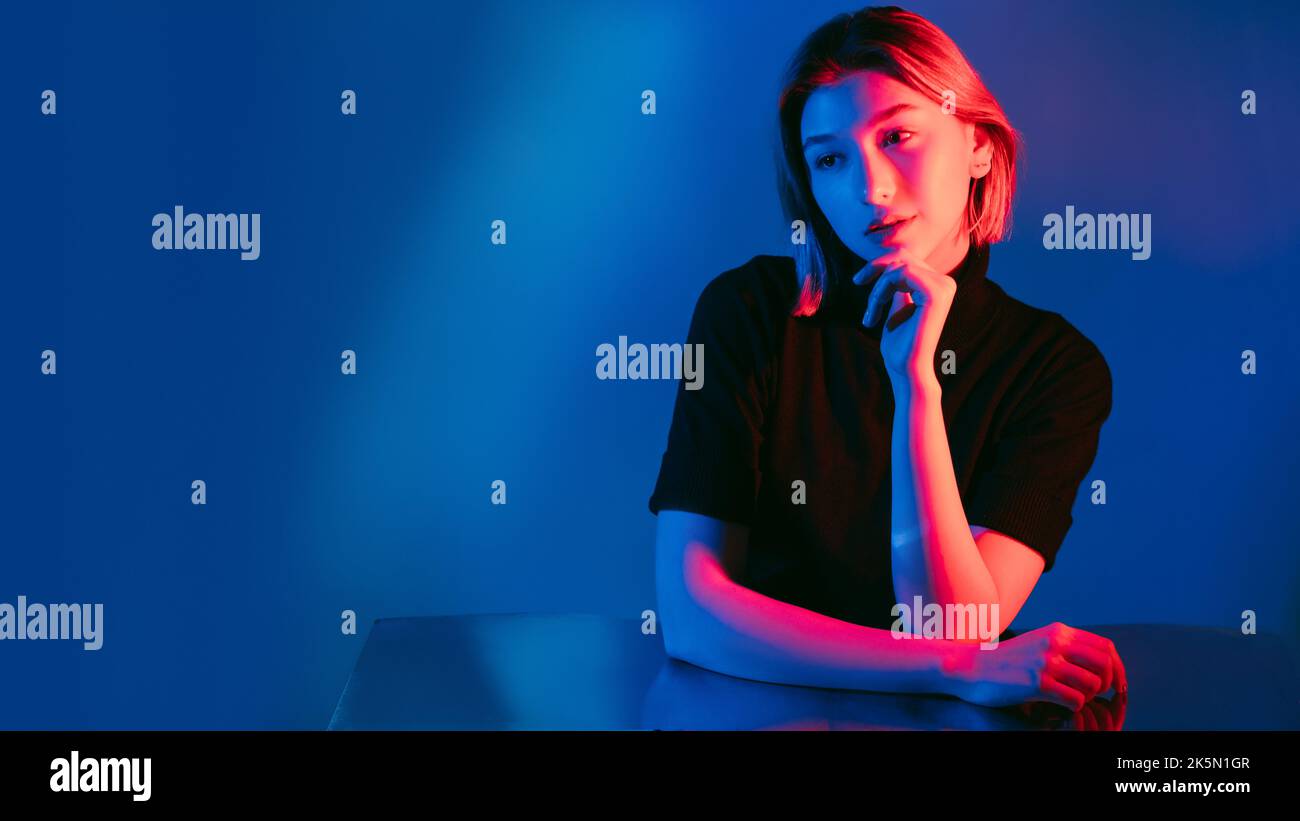 Pensive woman. Neon light banner. Tenderness melancholy. Portrait of ...