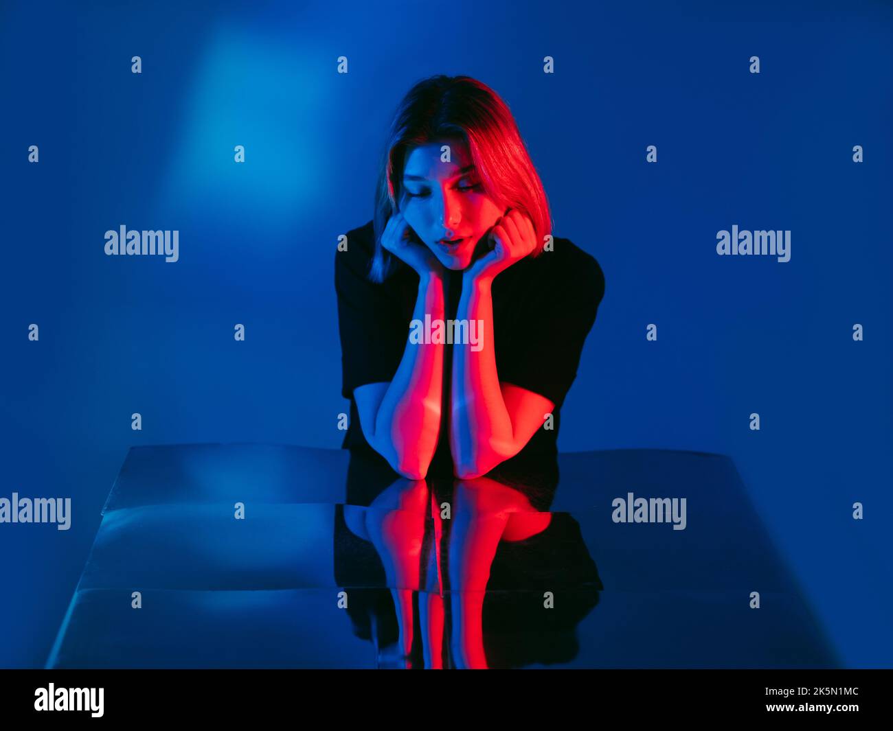 Sad woman. Neon light portrait. Loneliness melancholy. Upset depressed ...