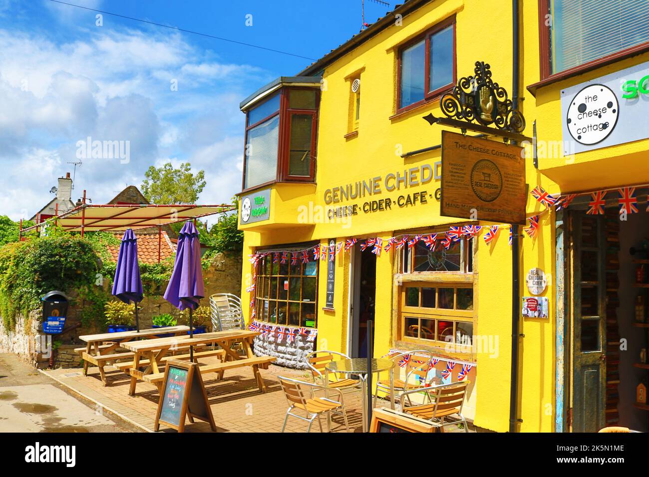 Street view with Pretty old houses of Cheddar -a large village and ...