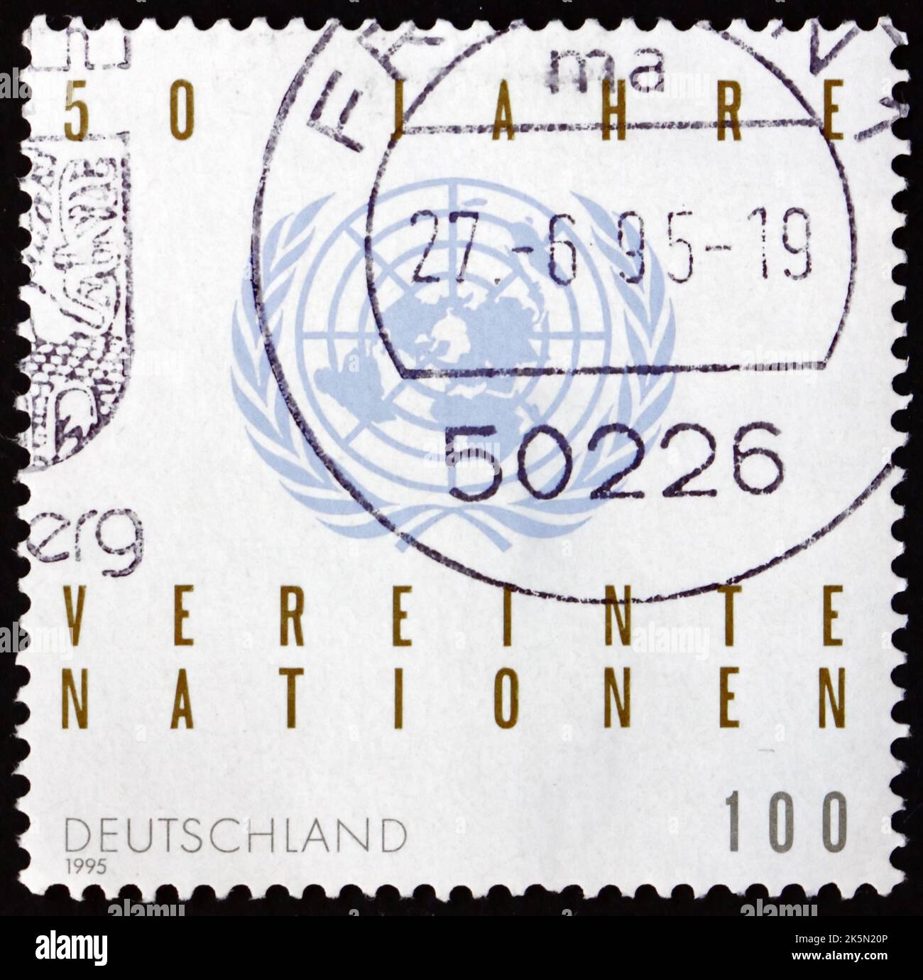 GERMANY - CIRCA 1995: a stamp printed in Germany shows UN emblem, 50th ...