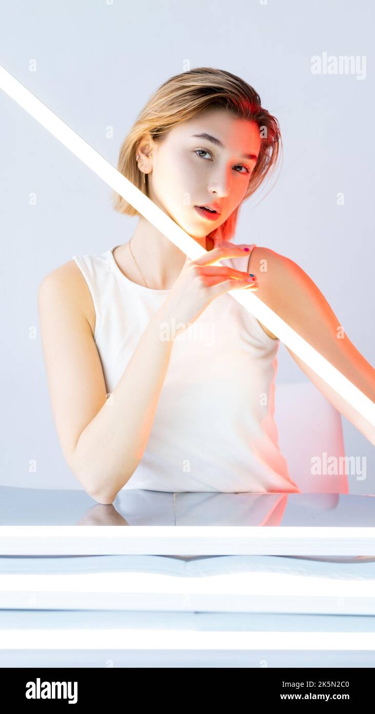 Light therapy. Beauty face. LED dermatology. Art portrait of confident ...