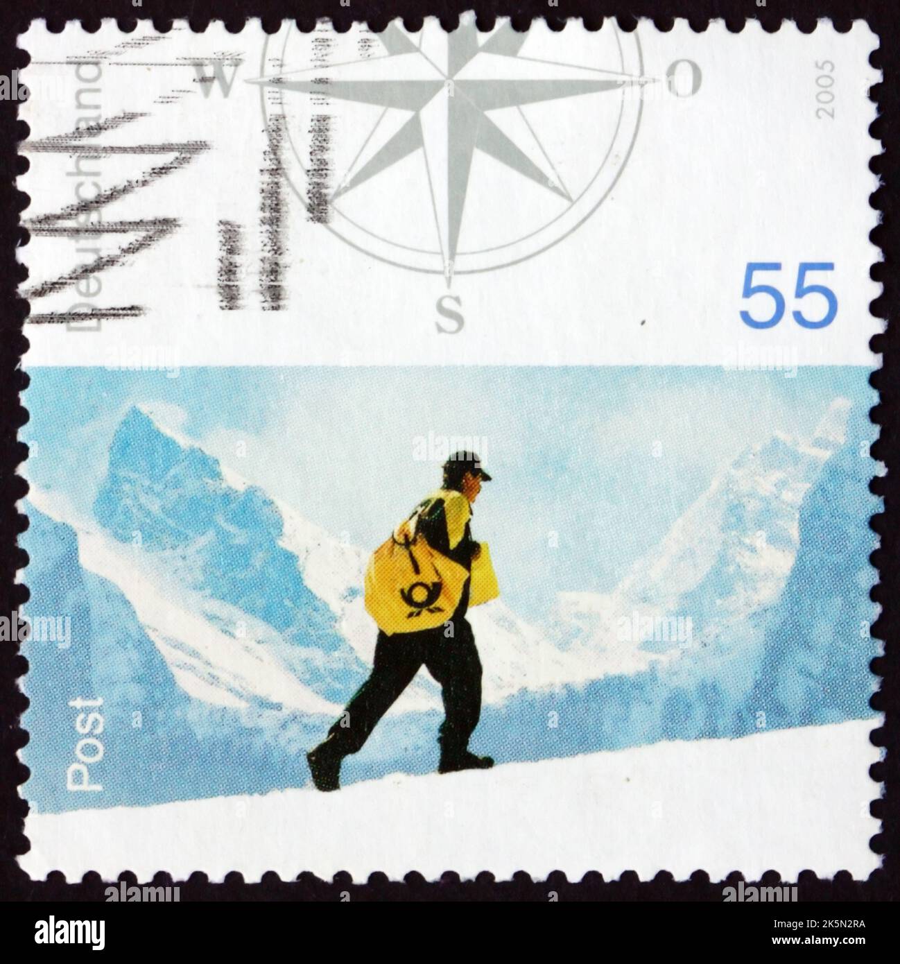 GERMANY - CIRCA 2005: a stamp printed in Germany shows postman on snowy ...
