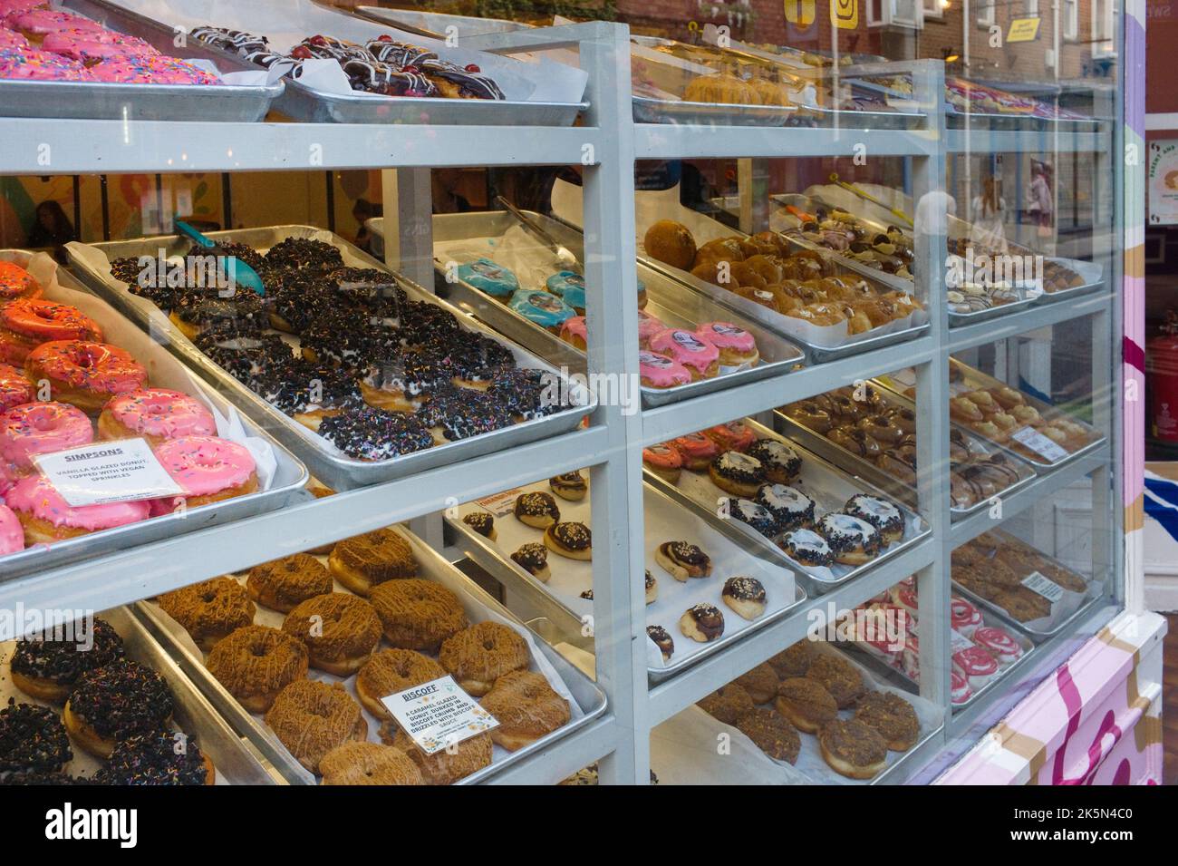 Window of a speciality doughnut shop in the centre of York Stock Photo ...