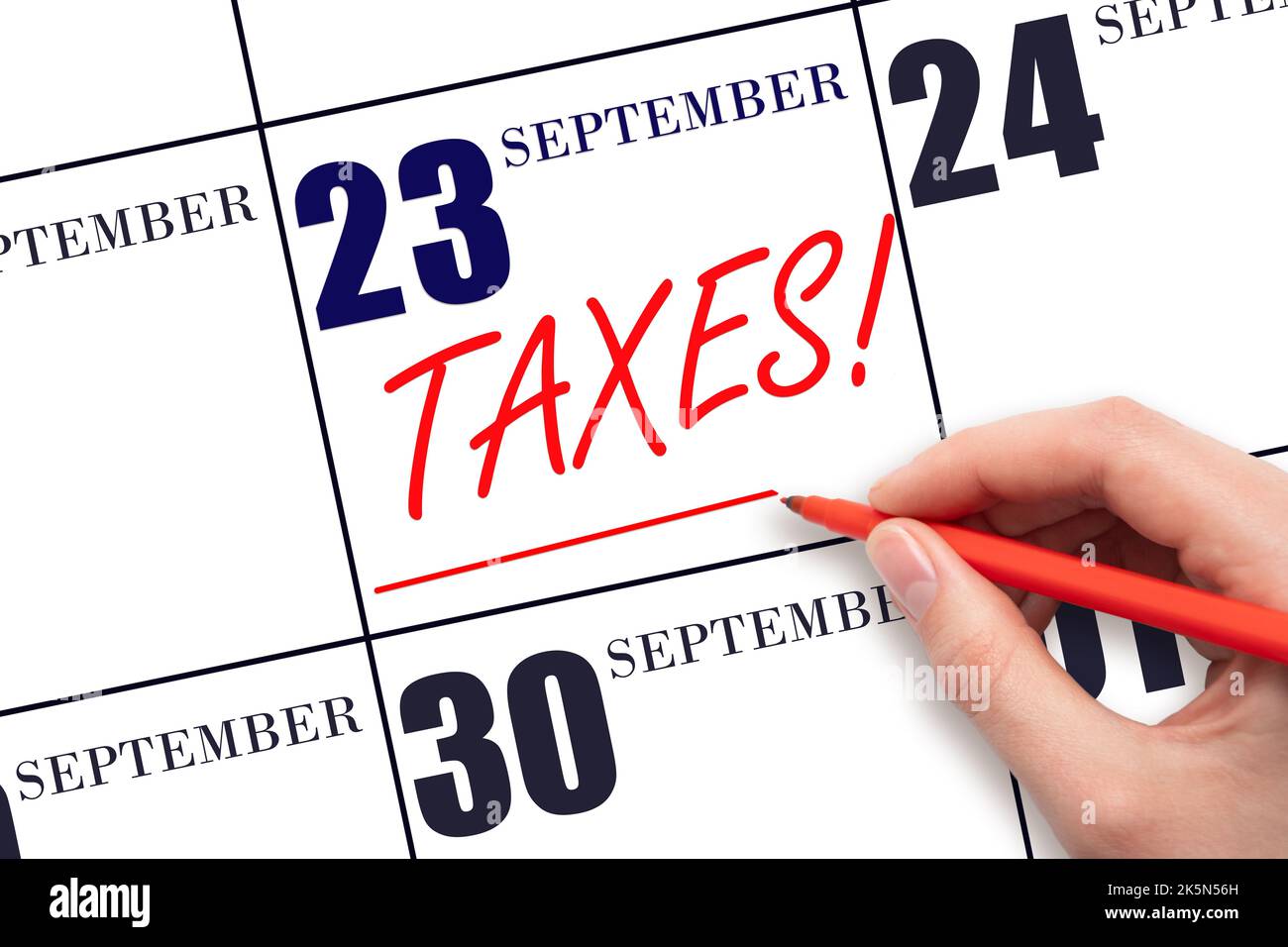 23rd day of September. Hand drawing red line and writing the text Taxes ...