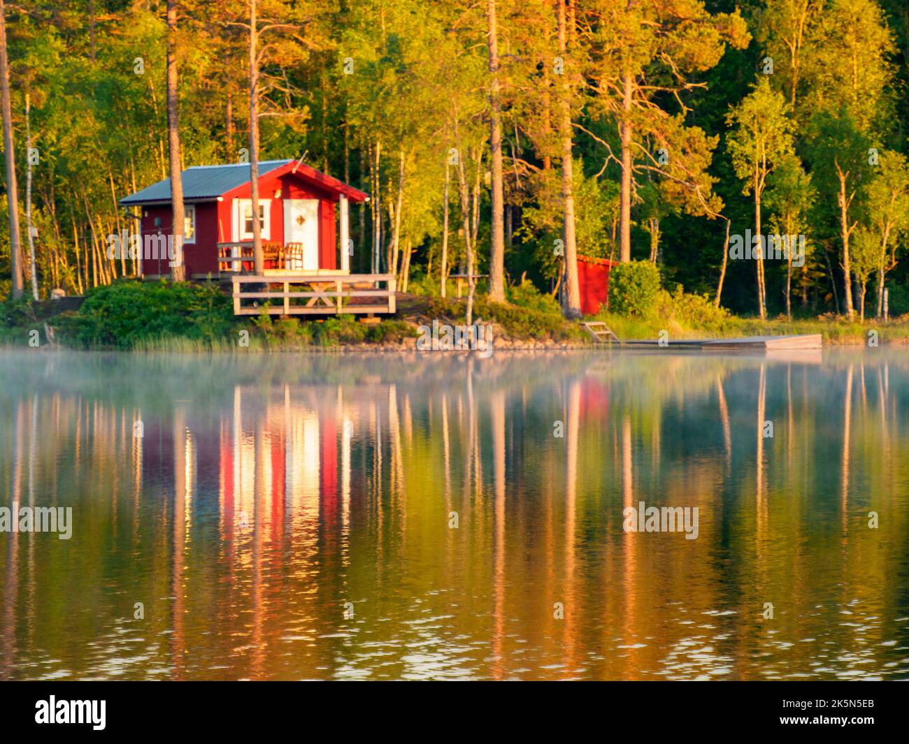 Sommarstuga, a Swedish summer house on the shores of foggy Lake ...