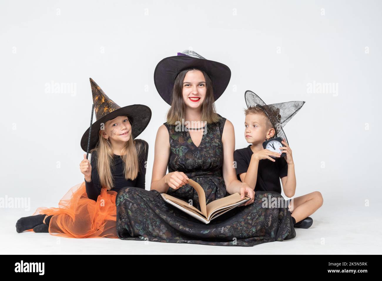 Family Halloween. A happy family in creepy costumes of witches and ...