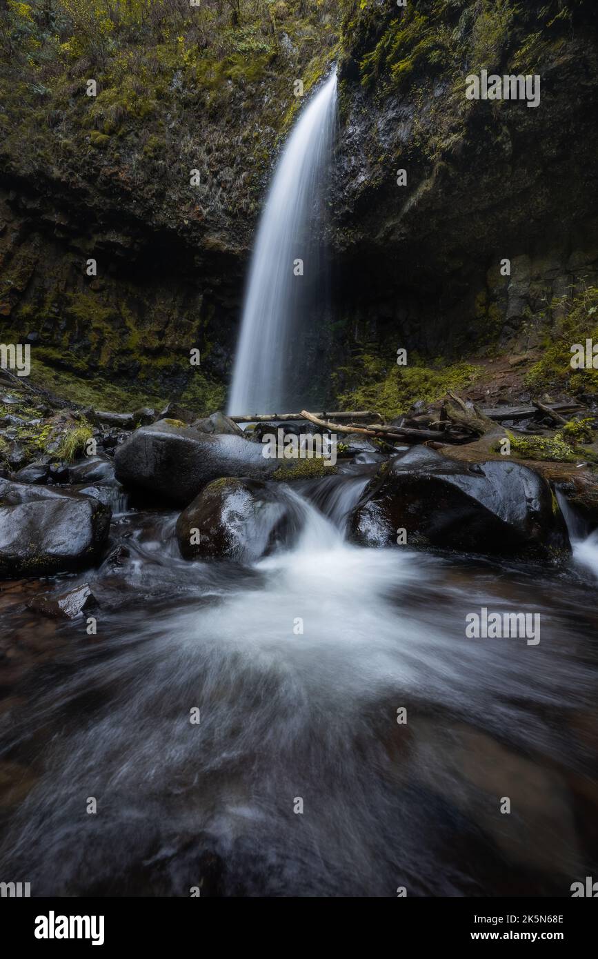 Beautiful waterfall flowing through ancient canyon landscape in the ...