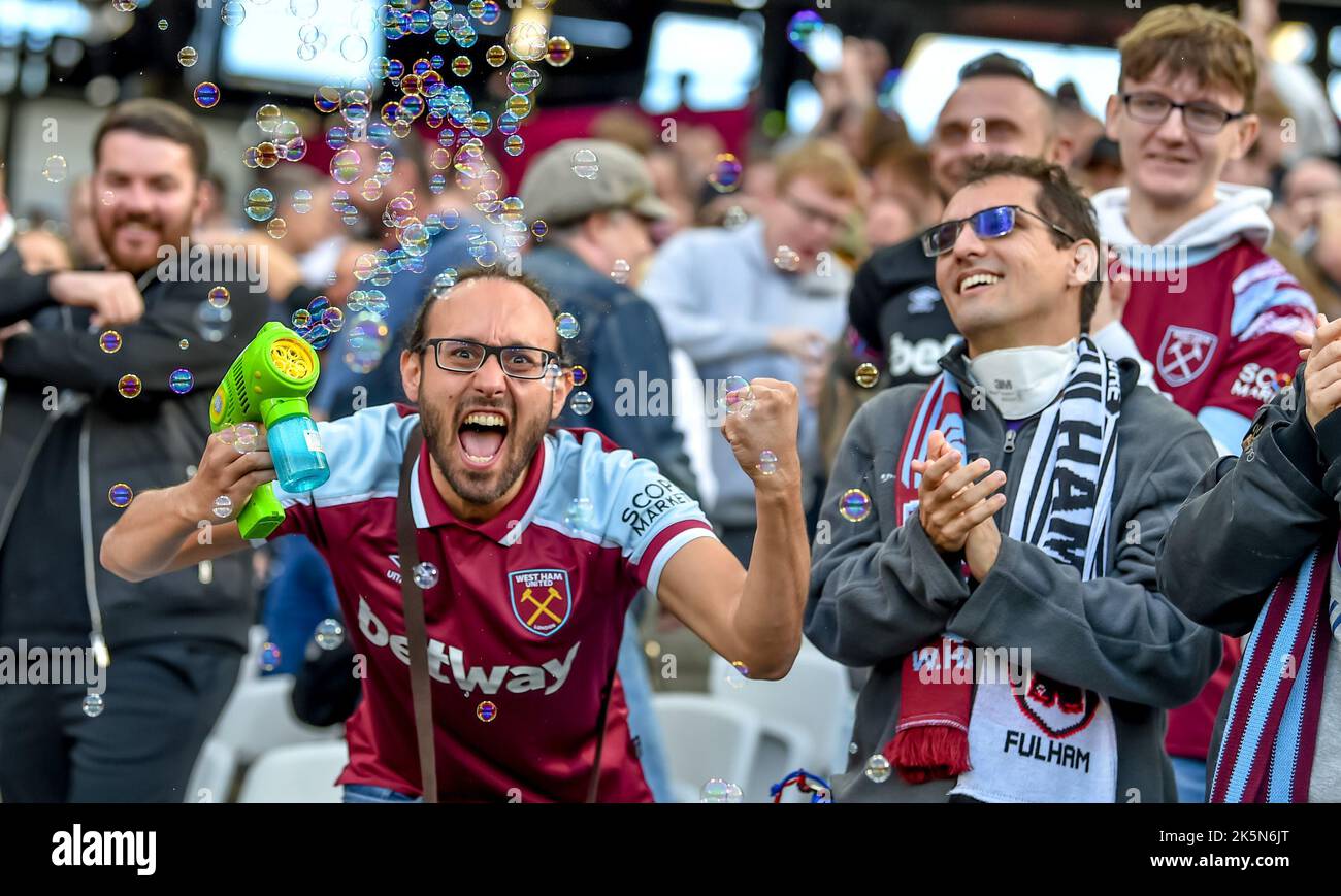 London, UK. 10th Oct, 2022. A West Ham United supporter adopting West ...
