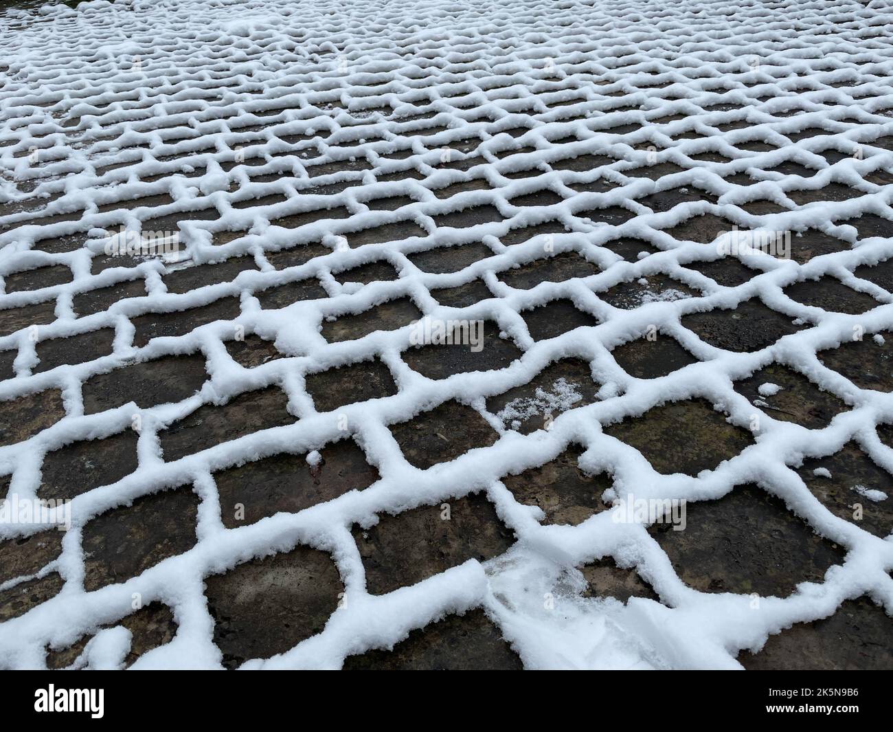 paving stones with snow Stock Photo - Alamy