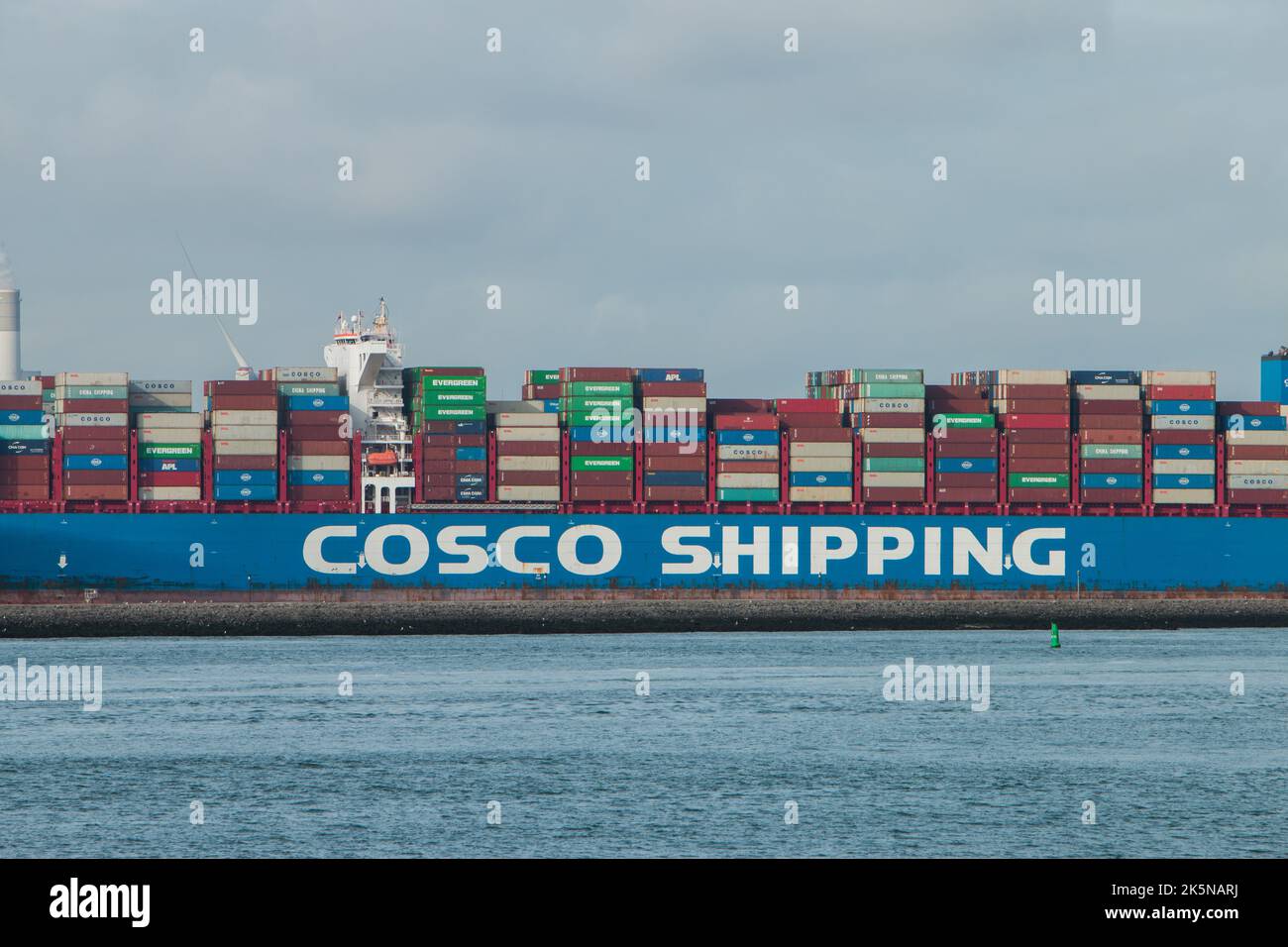 Cosco Shipping container ship moving up waterway towards port. Viewed ...